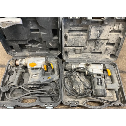 A Titan TTB698DRH hammer drill and a Titan magnesium rotary hammer drill