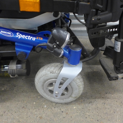 An Invacare Spectra XTR electric wheelchair - with charger but no battery
