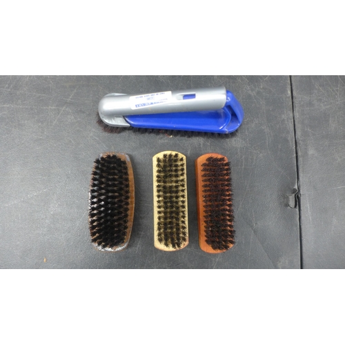 A quantity of boot polishing items including brushes, Kiwi shoe polish ...