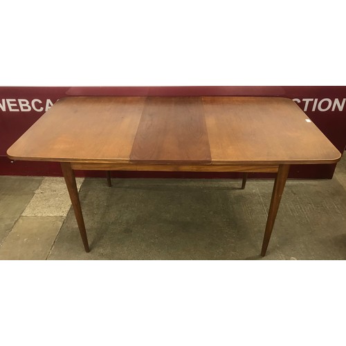 An Archie Shine teak rectangular extending dining table, designed by Robert Heritage