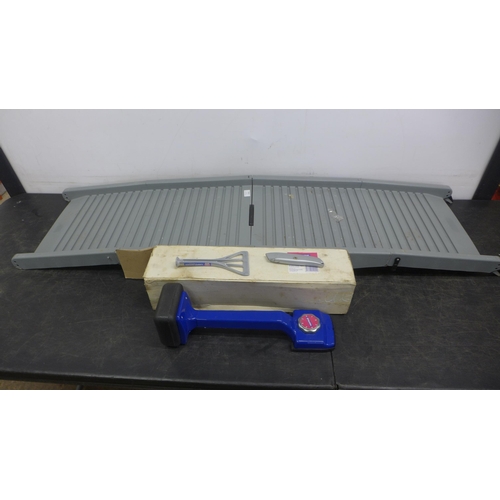A Tikatak extendable knee kicker - boxed and a plastic folding ramp