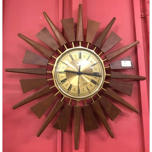 An Anstey Wilson teak sunburst wall clock