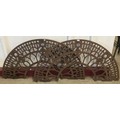 A pair of Victorian style cast iron semi-circular panels