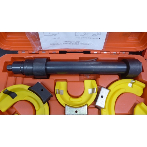 A cased oil drain plug thread repair kit and a cased MacPherson spring ...