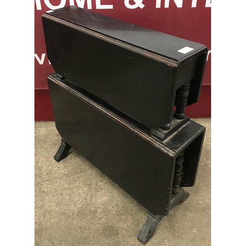 A Victorian Aesthetic Movement ebonised two tier Sutherland table
