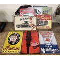 Twelve motoring related tin signs