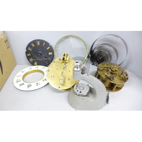 A collection of watch and clock tools, spares, parts, etc.