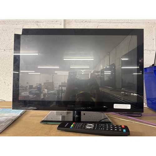 Sandstrom S24 HD TV with DVD player, includes manual and remote
