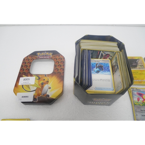 A Pokémon TCG Hidden Fates tin with approximately 200 cards from ...