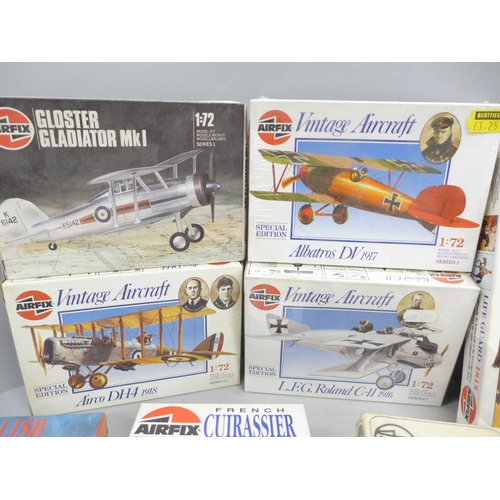Fourteen Airfix model kits, mounted soldiers and aircraft