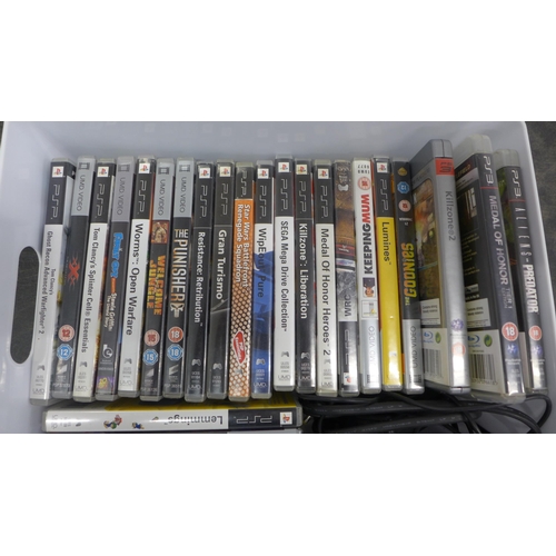 A Plano black PSP-1003 portable handheld games console with charging ...