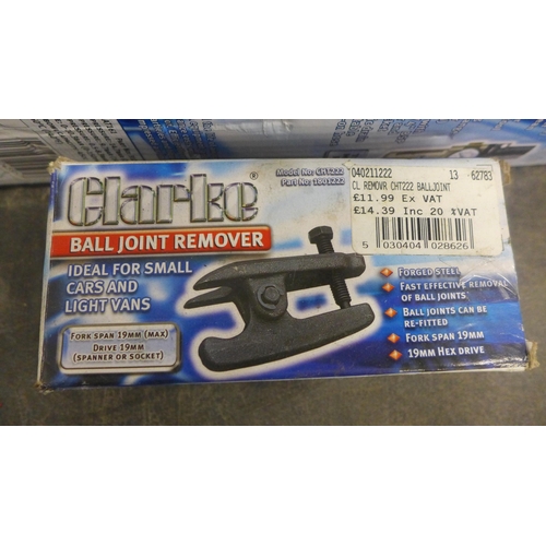 An assortment of tools including grease gun, air compressor, socket set ...