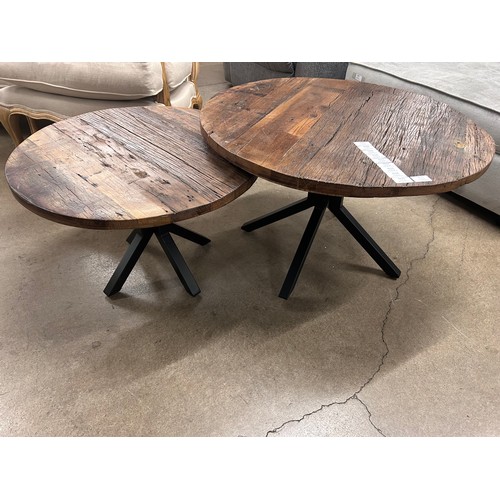 Two graduated Java sleeper wood and black metal circular coffee/side tables