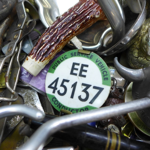 An AA car badges, three bus conductor badges, bottle openers ...