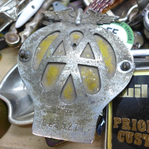 An AA car badges, three bus conductor badges, bottle openers ...