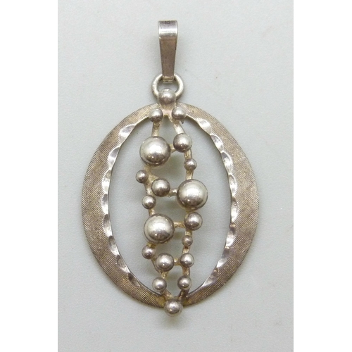Andreas Daub, a German Brutalist silver pendant with brushed texture ...