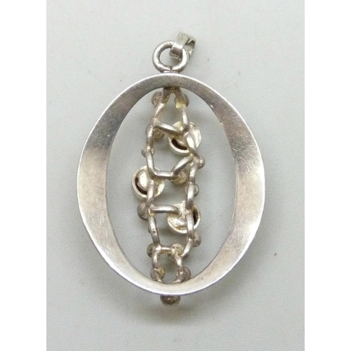 Andreas Daub, a German Brutalist silver pendant with brushed texture ...