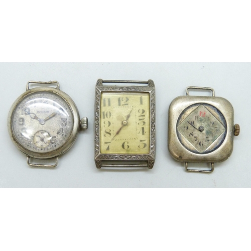 Three silver watch heads including a Waltham Trench style watch ...