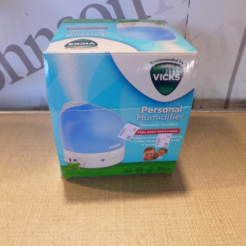 Two Brita max jugs, Vicks humidifier and a pop and load laundry basket ...