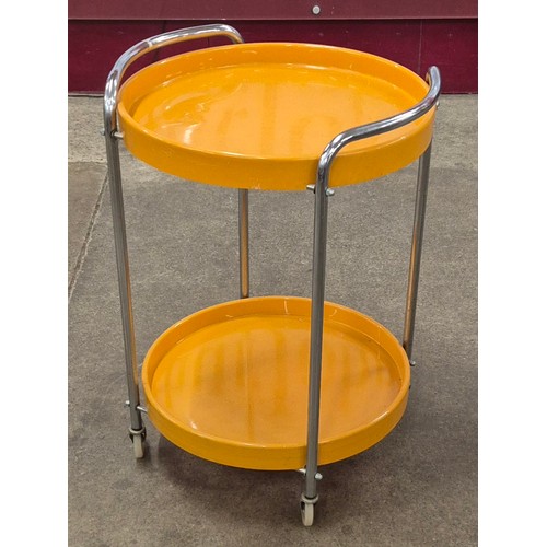 An Italian chrome and orange Perspex circular cocktail trolley