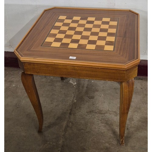 A 20th Century inlaid walnut games compendium table