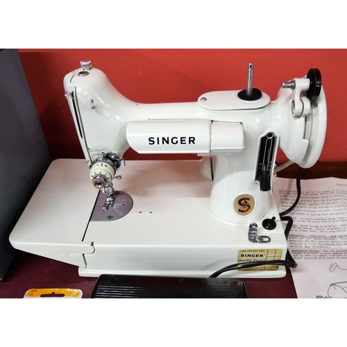 A Singer Featherweight model 221 sewing machine, cased, with quality ...