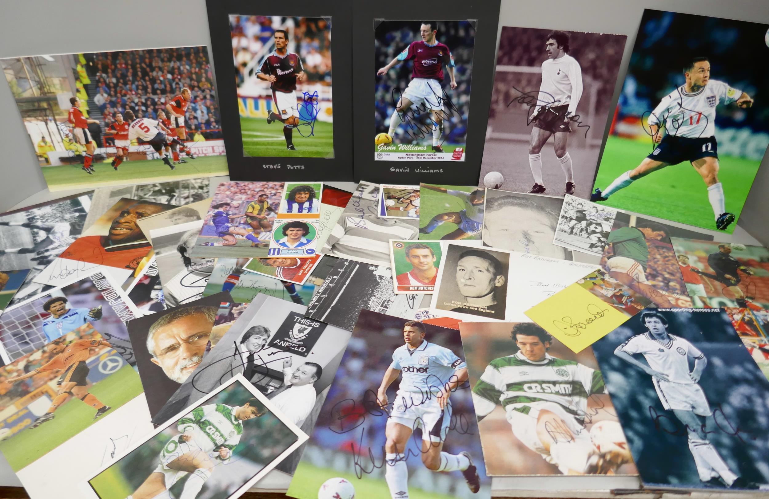 A collection of signed football players cards, cuttings and some ...