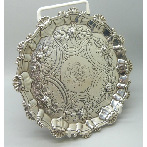 A George III silver salver with embossed floral design and monogram ...