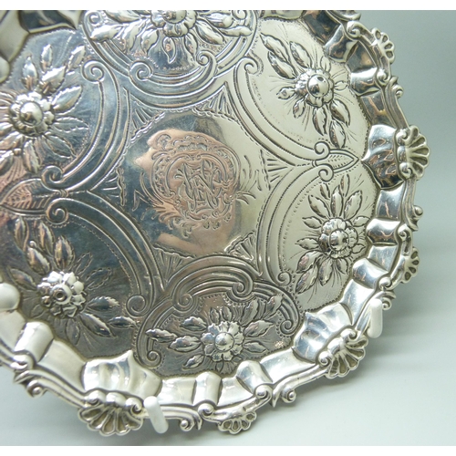 A George III silver salver with embossed floral design and monogram ...