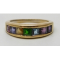 A silver gilt multi gemstone band ring, L/M