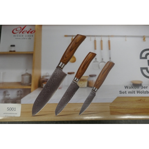 A set of 3 kitchen knives with Damascus blades with a wooden storage ...
