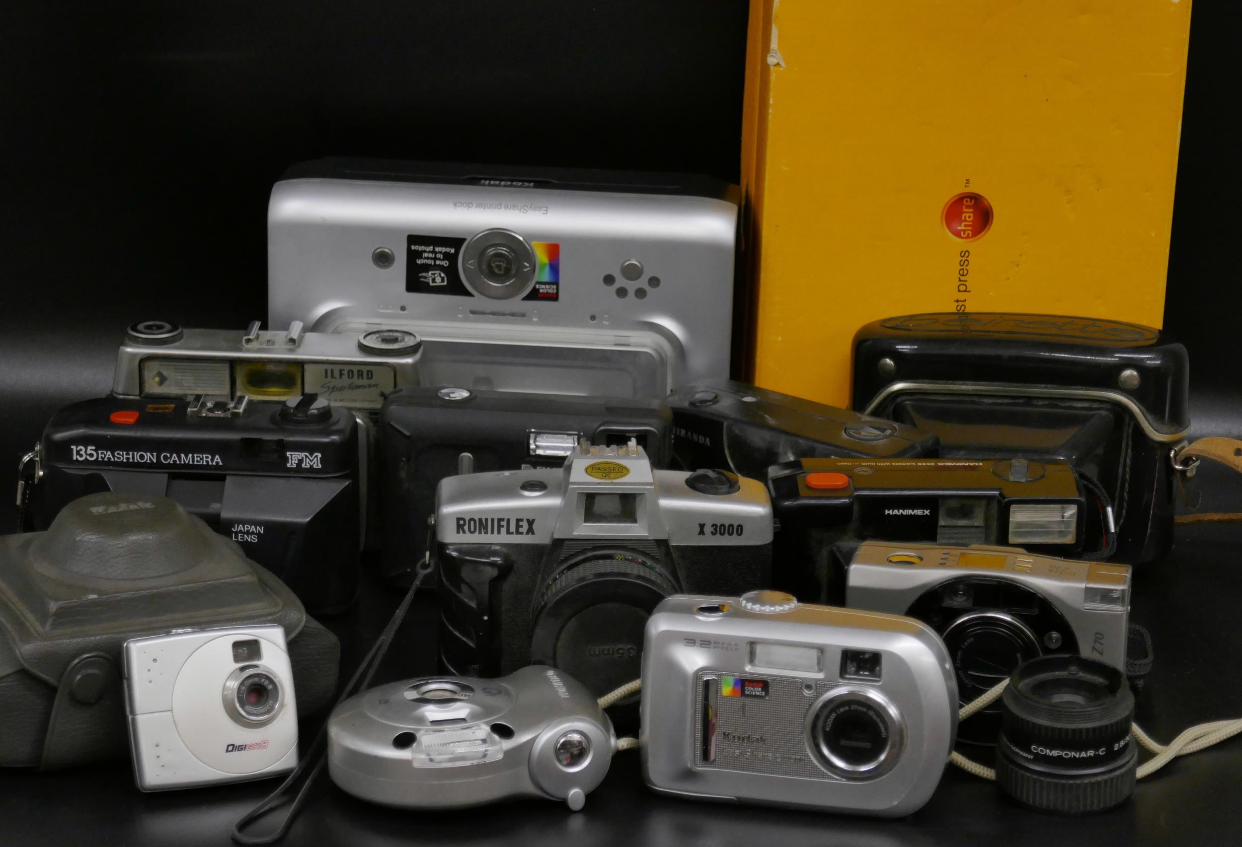 A collection of pocket and SLR cameras, to include Fujifilm, Hanimex ...