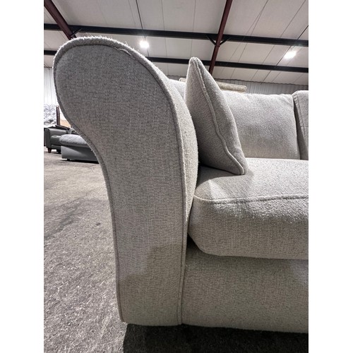 A beige fabric upholstered 3 piece corner sofa (back staples require ...