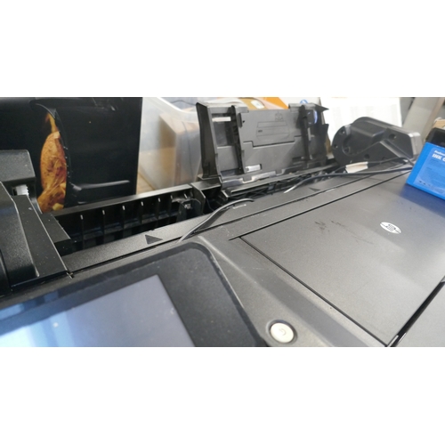 A HP Design Jet T120 E-Printer with assorted part full ink cartridges