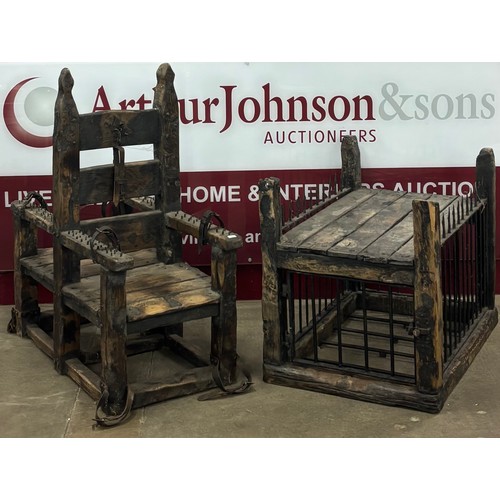 A Medieval style elm and cast iron twin interrogation / torture chair ...