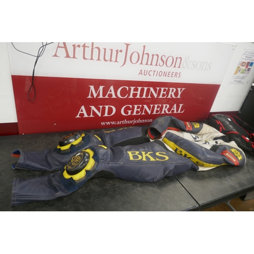 A BKS leather full body motorbike suit and AST body armour vest