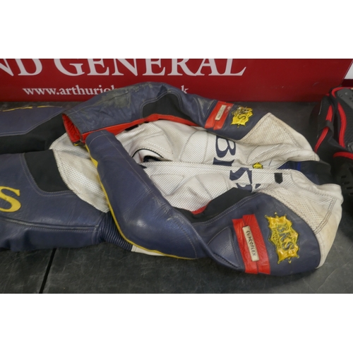 A BKS leather full body motorbike suit and AST body armour vest