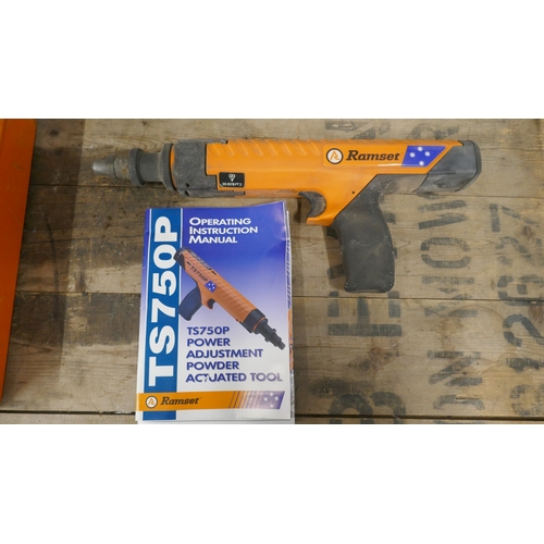 A cased Ramset TS750P powder actuated tool set with drive pins, wire ...