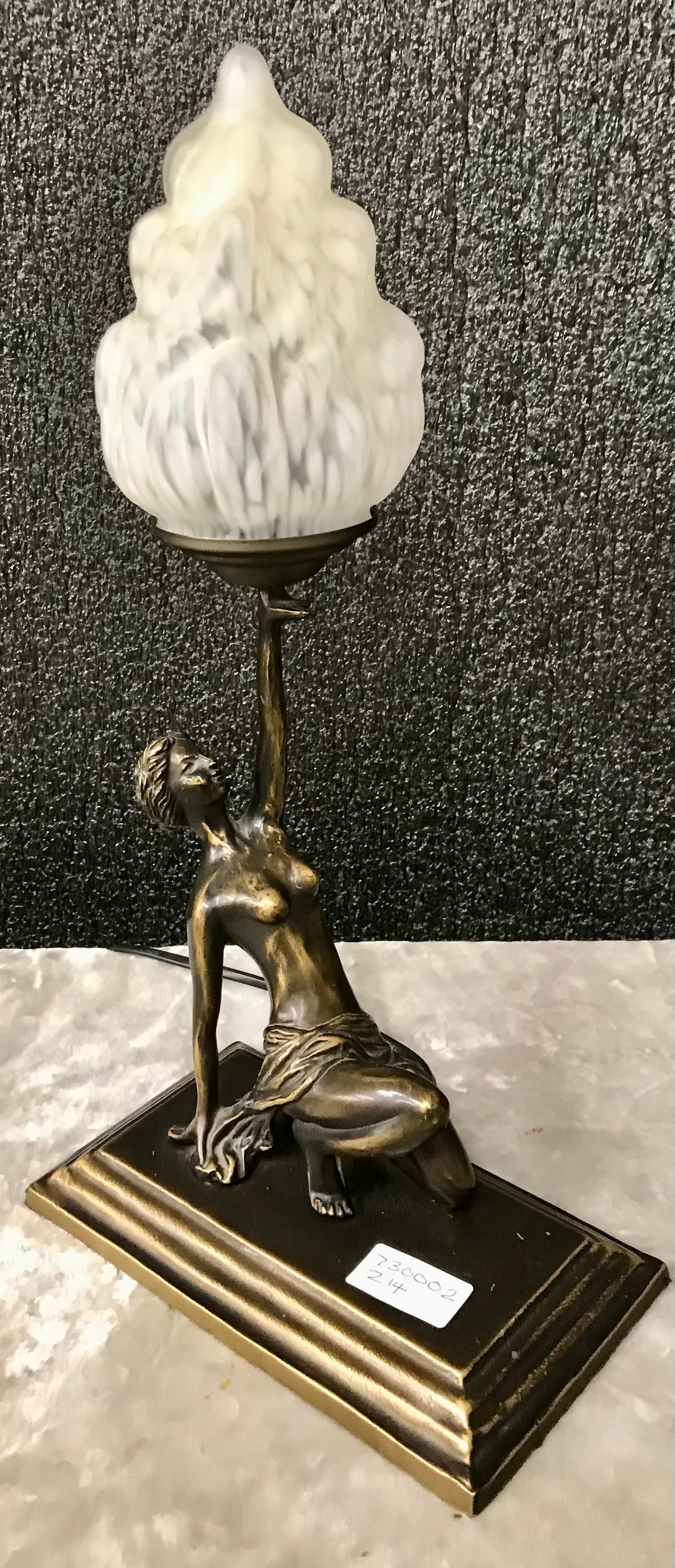 An Art Deco style simulated bronze figural table lamp