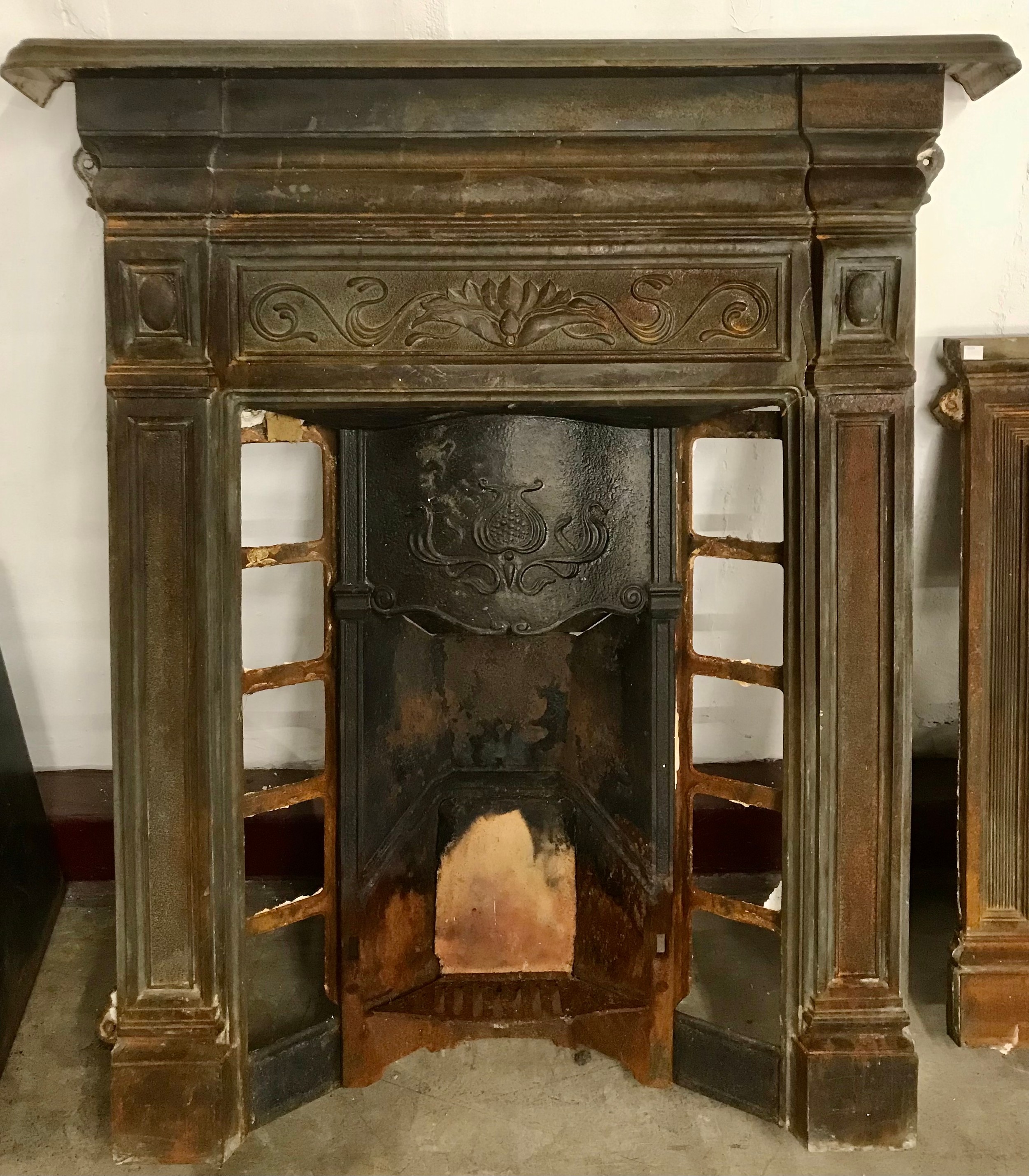 A Victorian cast iron fire surround