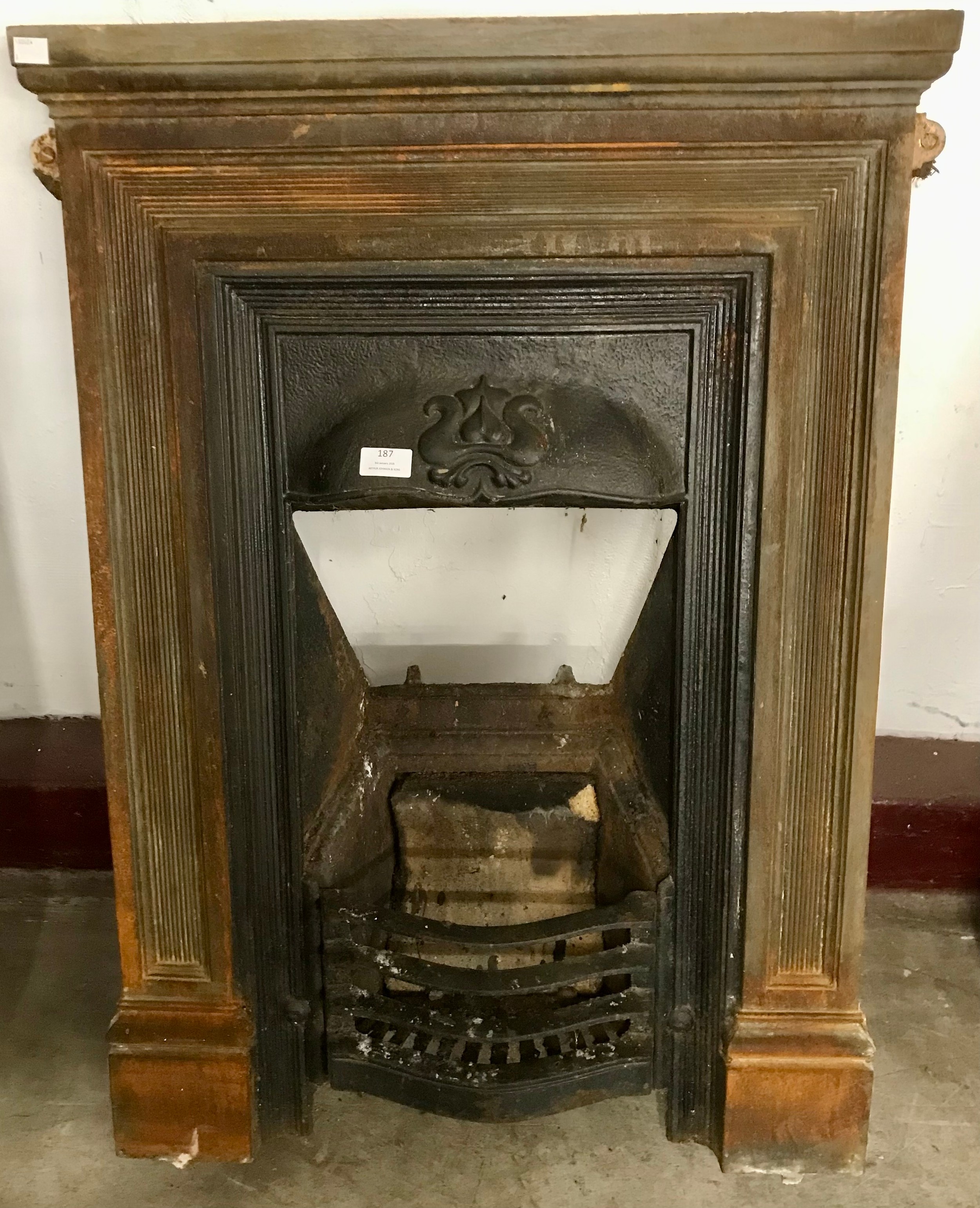 A Victorian cast iron fire surround