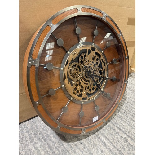 A nautical style circular frame moving gear wall clock (display)