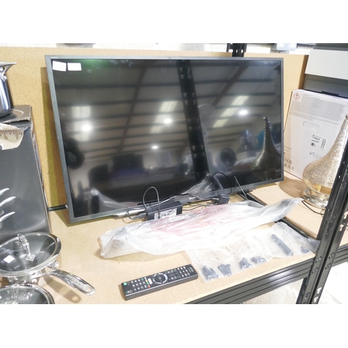 A Sony 40" television with stand and remote KDL40WD653