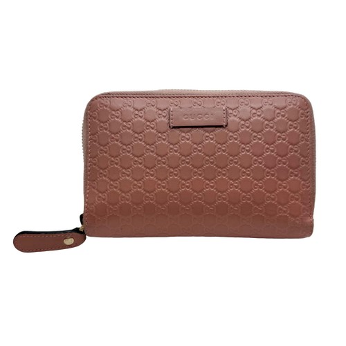 A Gucci dusky pink monogram leather wallet, serial number 449423 2067 ...