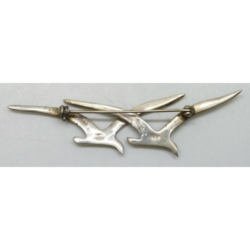 A Modernist silver brooch in the form of two birds in flight, marks ...