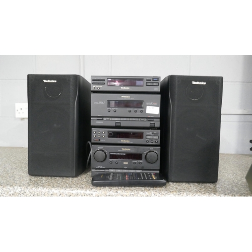 A Technics mini Hi-fi system with 2 speakers and remote