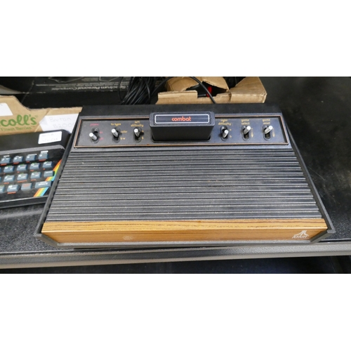 An Atari CX-2600 video computer system with 2 paddle controllers, 2 ...