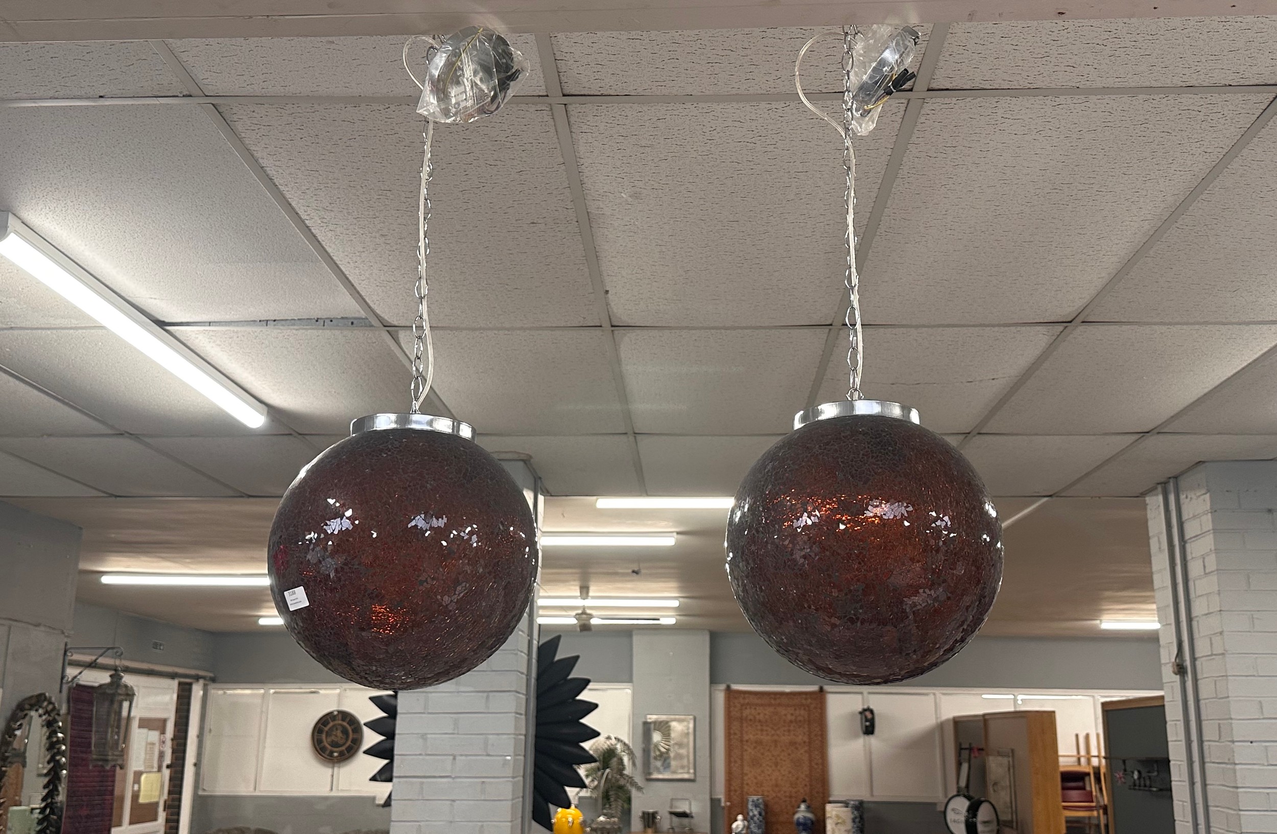 A pair of brown mosaic hanging ceiling lights