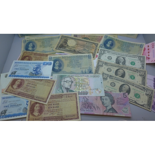 A collection of world bank notes including USA, UK, Zimbabwe, South ...