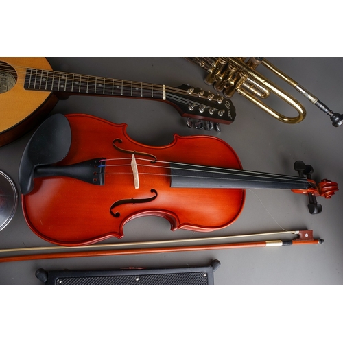 Assorted musical instruments to include: 1. an Ozark mandolin, in ...